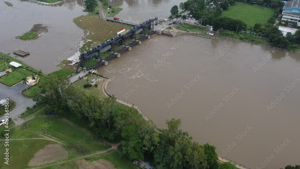 Aerial view of Rama 6 Dam (Phra Narai Gate) with powerful of water ...