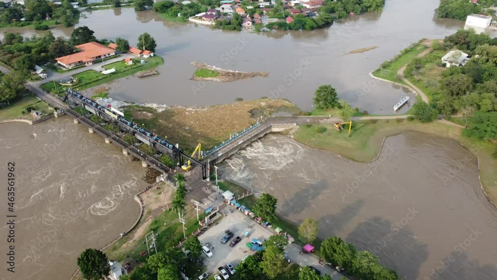 Aerial view of Rama 6 Dam (Phra Narai Gate) with powerful of water ...