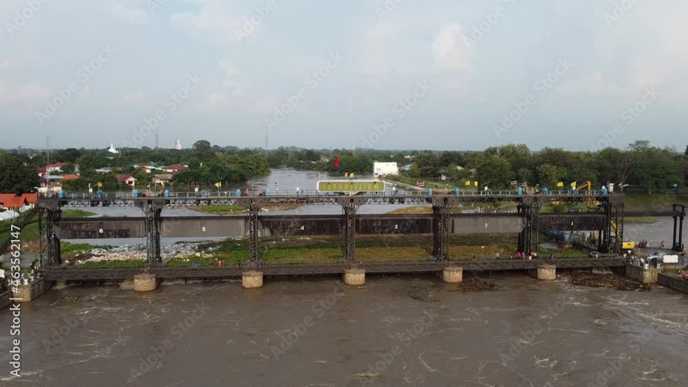 Aerial view of Rama 6 Dam (Phra Narai Gate) with powerful of water ...