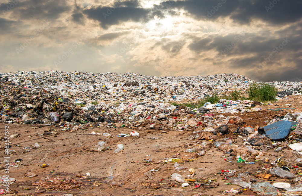 garbage dump pile in trash dump or landfill,backhoe and truck is ...