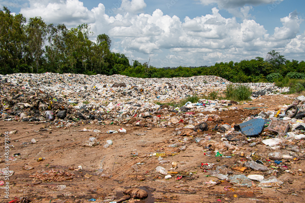 garbage dump pile in trash dump or landfill,backhoe and truck is ...