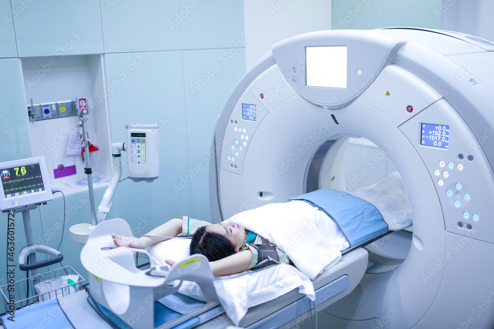 Patients screening on CT scanner. Man Undergoing CT Scan While Doctor's ...