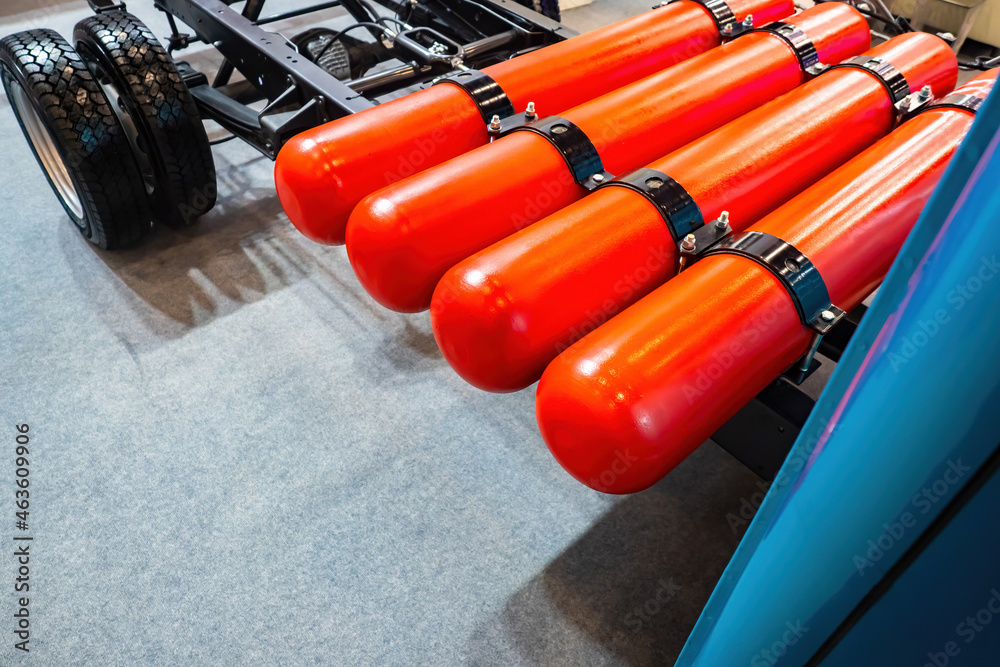 Red gas cylinders for transport. Vehicle runs on liquefied gas ...