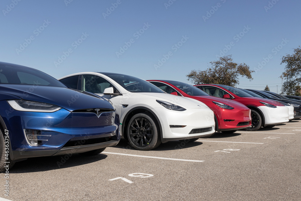Tesla EV electric vehicles on display. Tesla products include electric ...