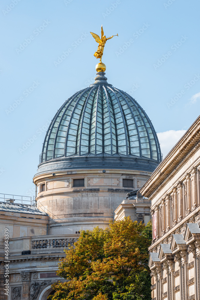 Old statue of a golden angel as a warrior and defender at the dome top ...