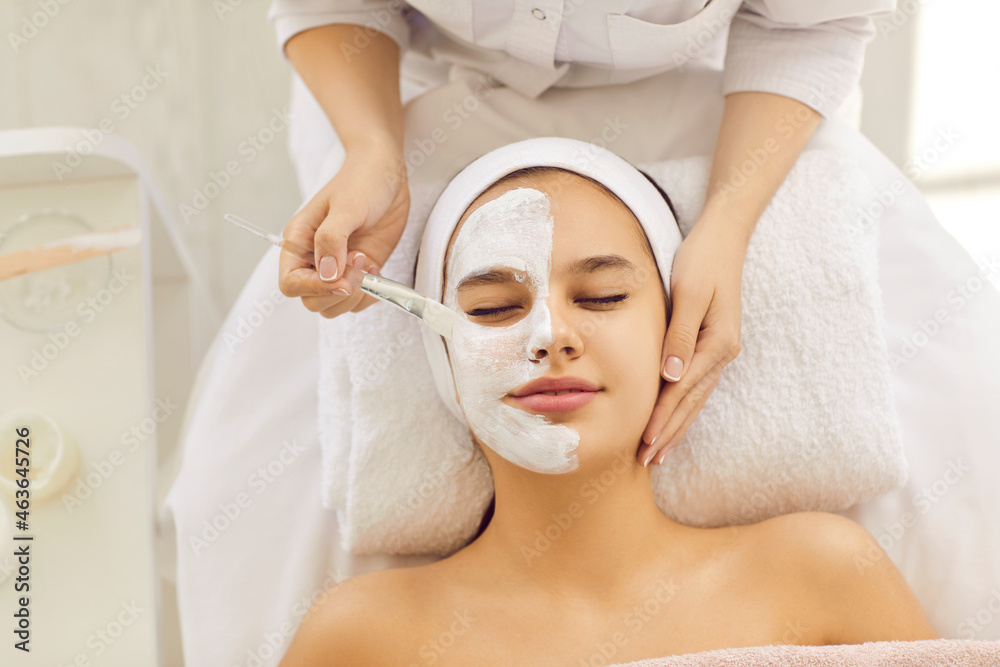 Top view of cosmetologist do facial mask for healthy glowing skin for ...