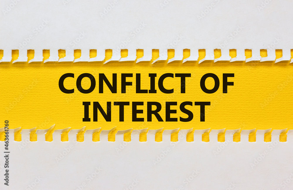 Conflict of interest symbol. White and yellow paper with words ...