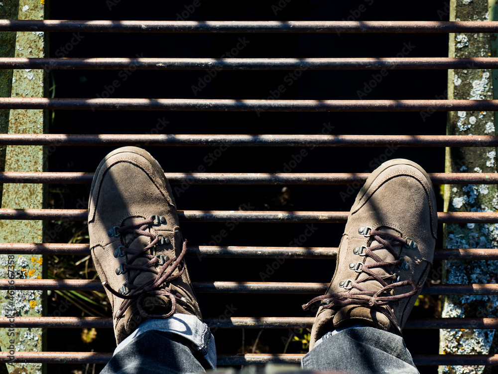 suede boots top view stand on an iron bridge over an abyss Stock Photo ...