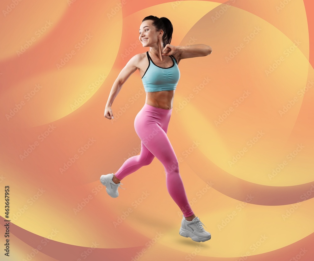 Smiling young fitness model in sportswear doing exercise Stock Photo ...