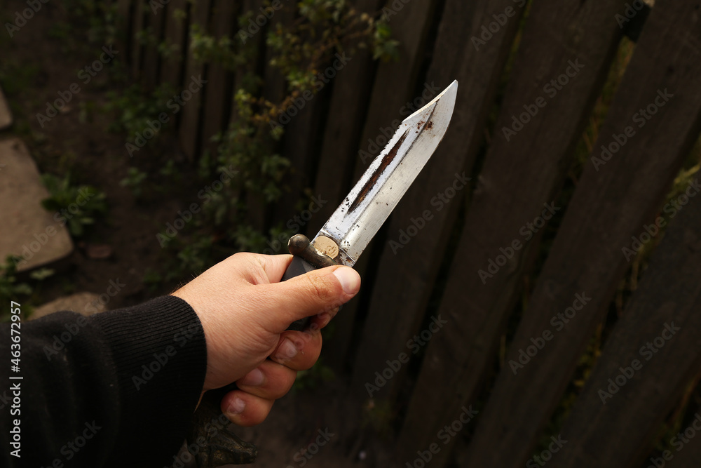 Vintage bayonet knife in the hand Stock Photo | Adobe Stock