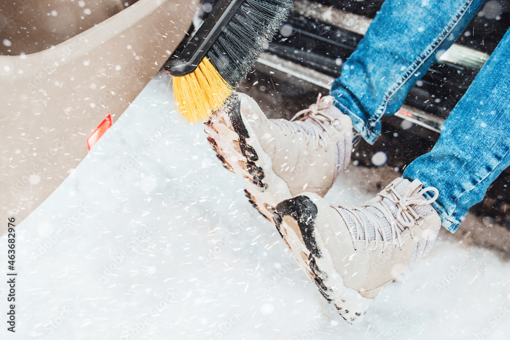 Cleaning snow from boots before getting into the car - keeping the car ...