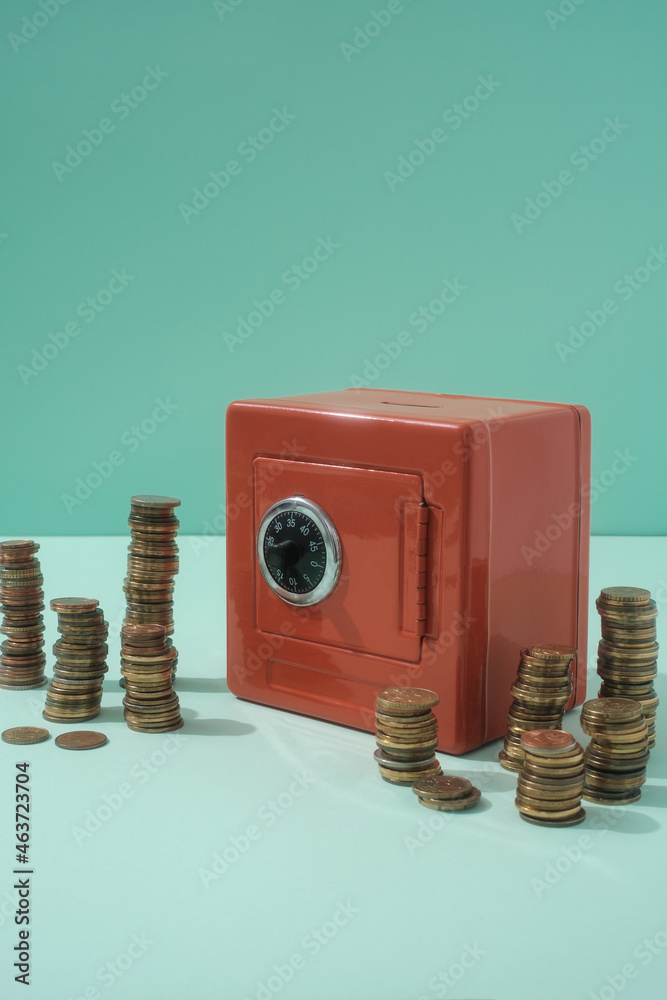 Safe With Combination Lock And Stacked Coins Stock Photo | Adobe Stock