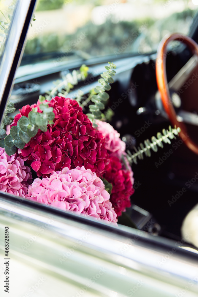 Pink and red flowers through window of car Stock Photo | Adobe Stock