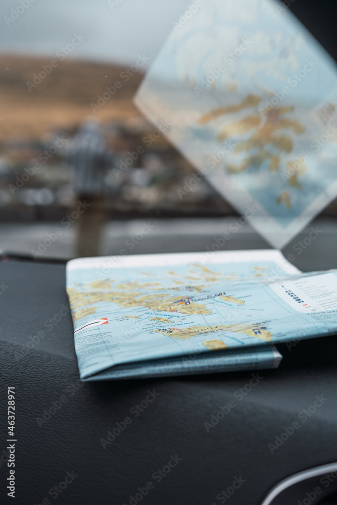 Folded map on car dashboard Stock Photo | Adobe Stock