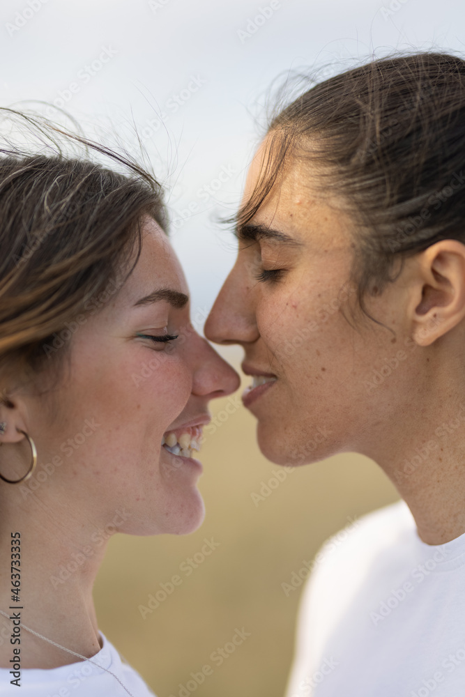 kissing her girlfriend's nose Stock Photo | Adobe Stock