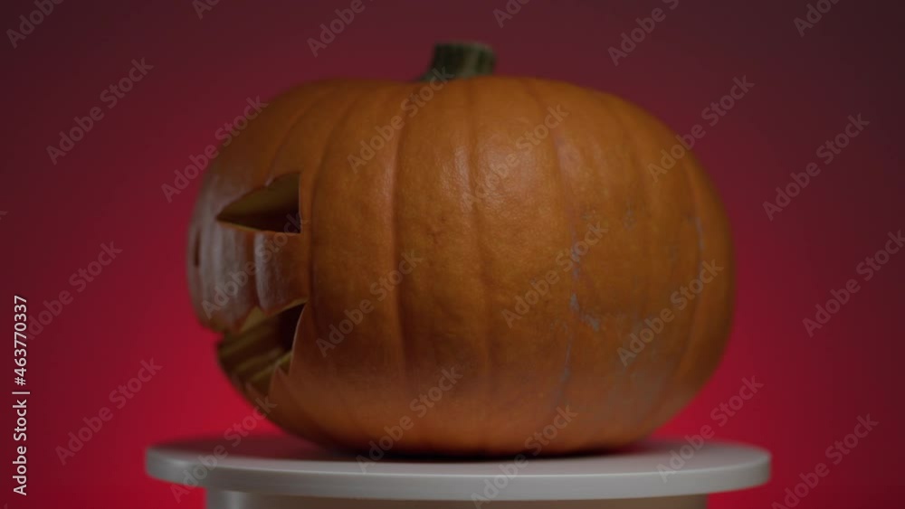 continuous looping halloween pumpkin with carved teeth, eyes and nose ...