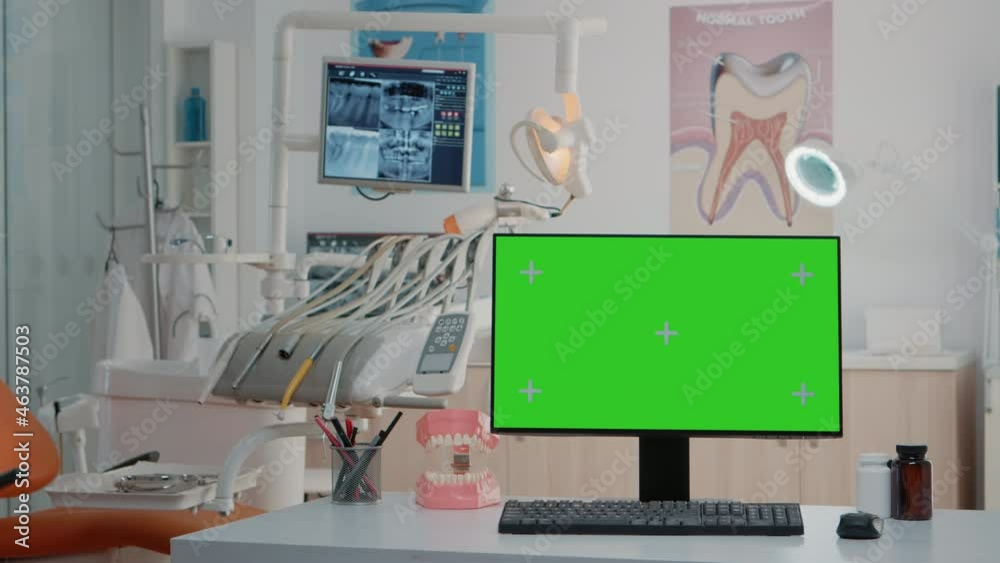 Empty dental cabinet with horizontal green screen on monitor. Nobody in ...