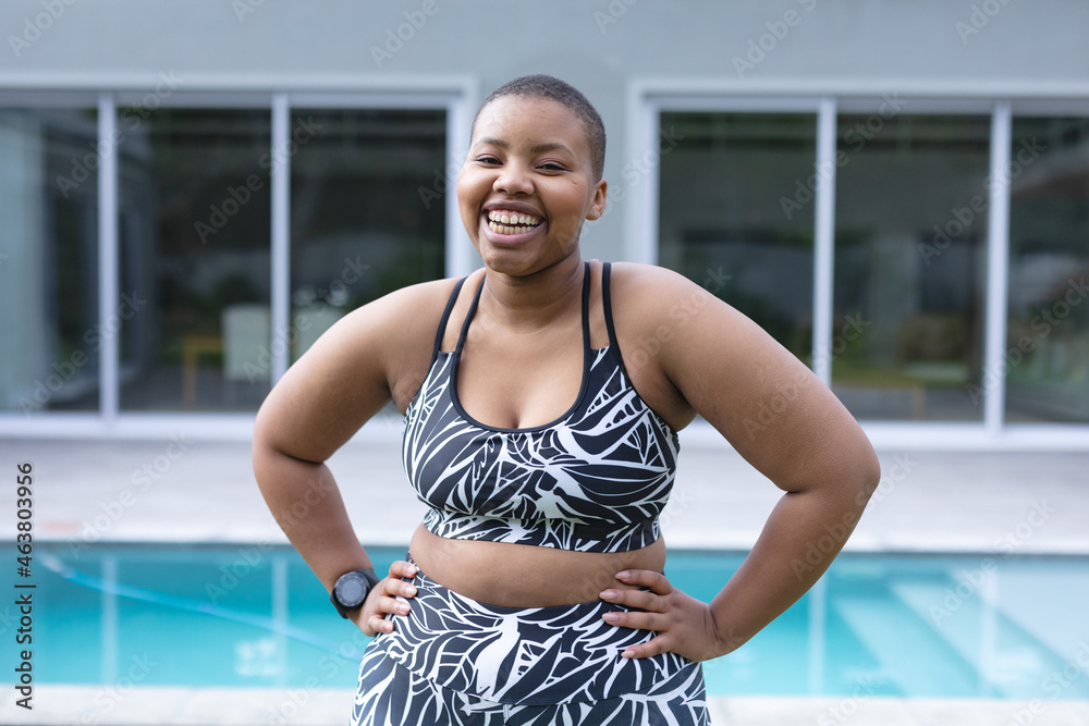 Happy african american plus size woman wearing sports clothes and ...