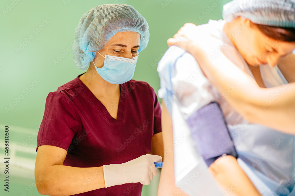 Pregnant woman has a peridural anesthesia by child birth. Epidural ...