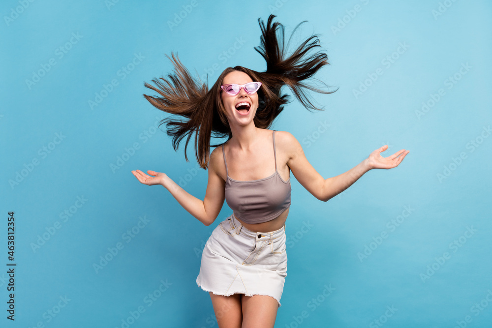 Portrait of attractive cheerful girl having fun good nood hair flying ...