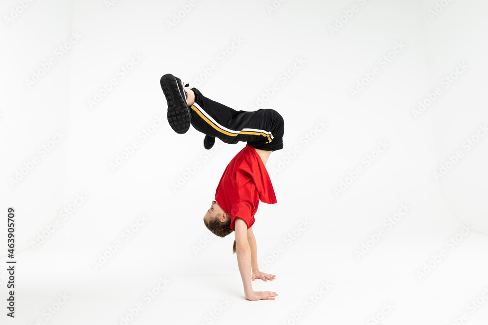Isolated young Russian girl hip hop break dancer wearing red t-shirt ...