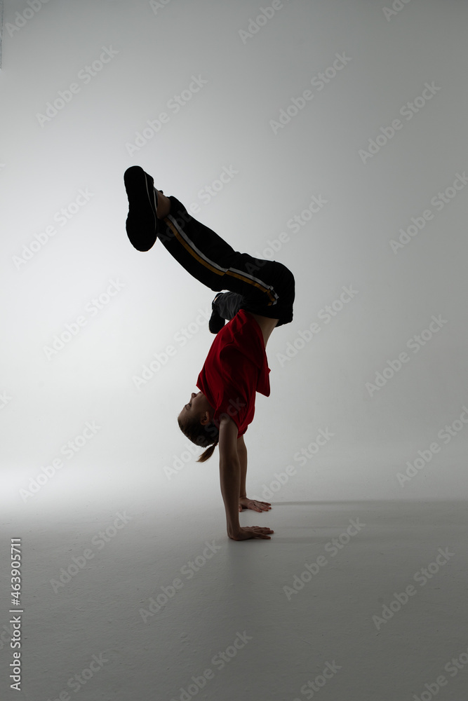 Isolated young Russian girl wearing red t-shirt hip hop break dancer ...
