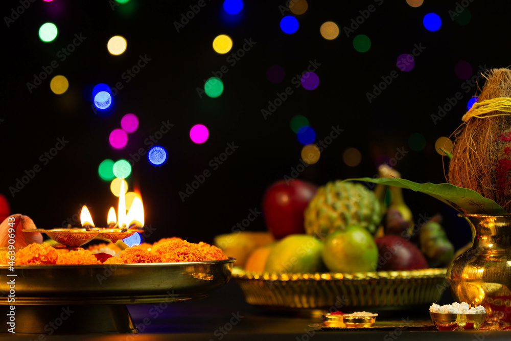 Golden Brass Diya Illuminated and fruits with Dark Black Background and ...