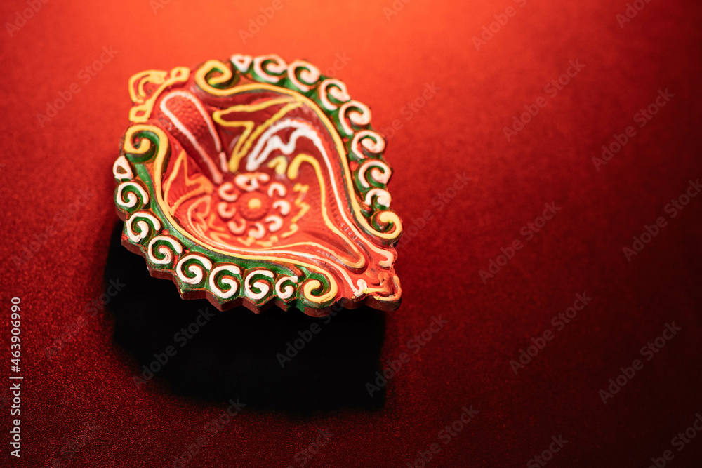 Mitti ka Diya Illuminated With Reflection In Dark Black Background with ...