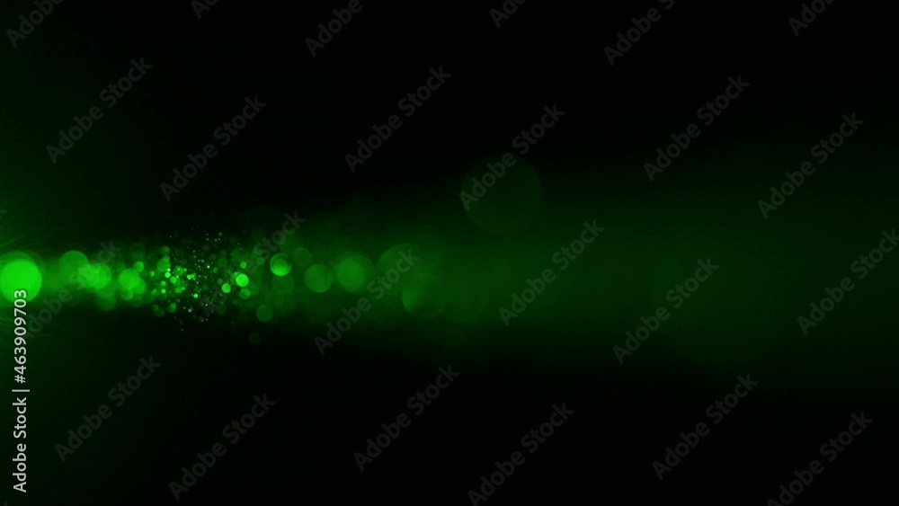 The green laser ray shining on a black background. slow motion Stock ...