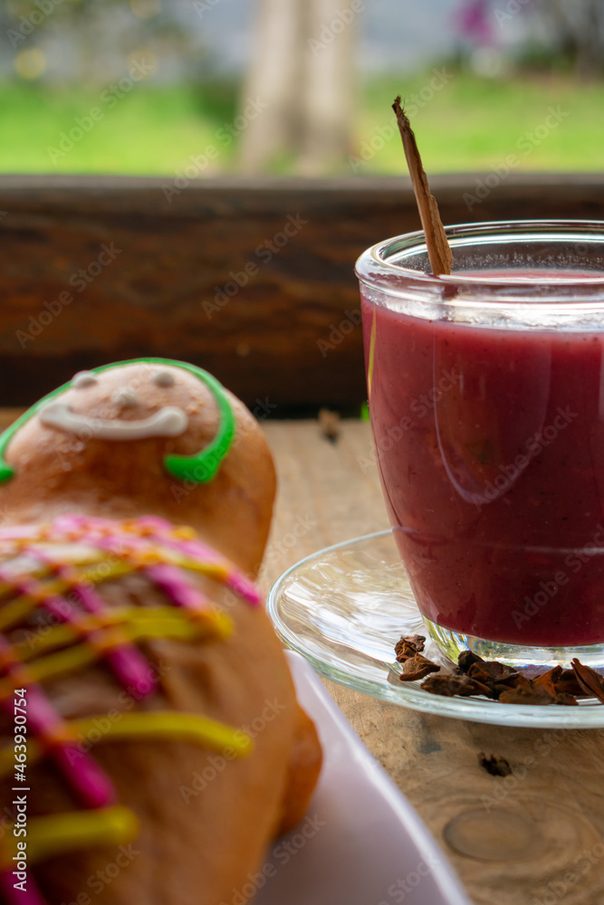 Close up of traditional ecuadorian food "Guaguas de pan y colada morada ...