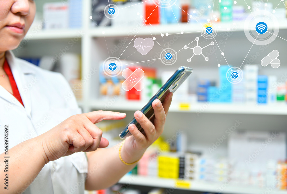 Pharmacist using mobile smart phone for search bar on display in ...