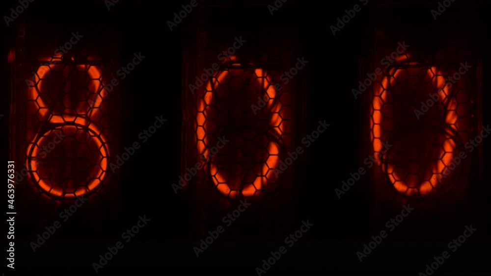 Retro vacuum tube display on the device counts seconds. Displaying ...