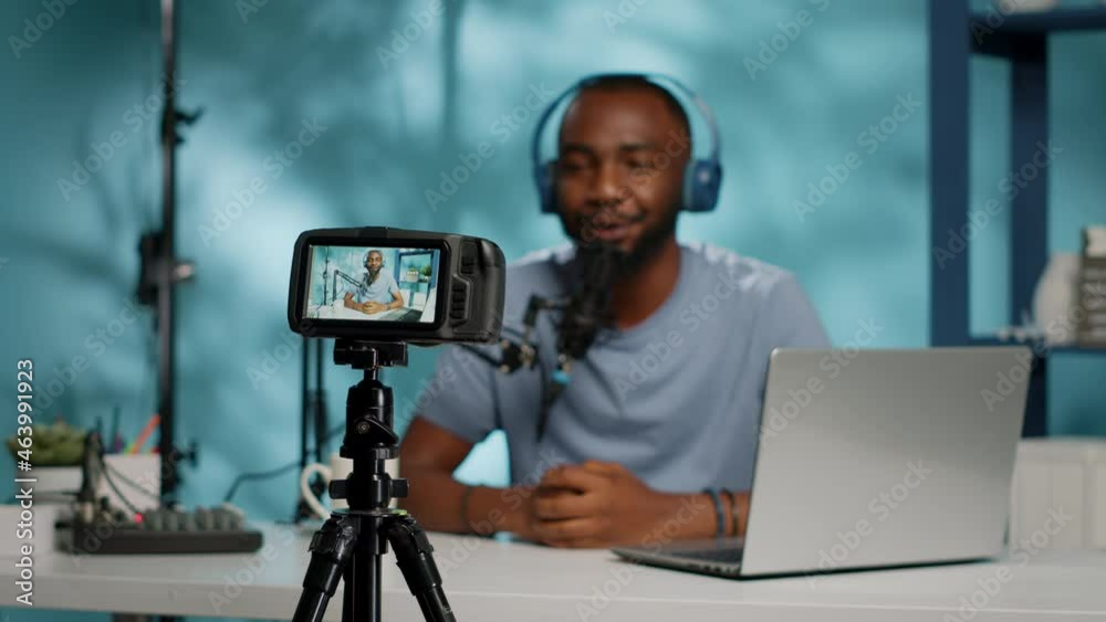 Stockvideo Close up of content creator recording video on camera using ...