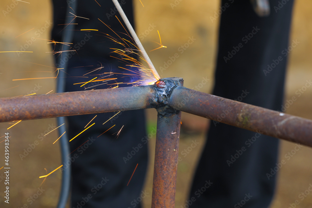 Welders working and jointing iron pipe at the factory Stock-Foto ...