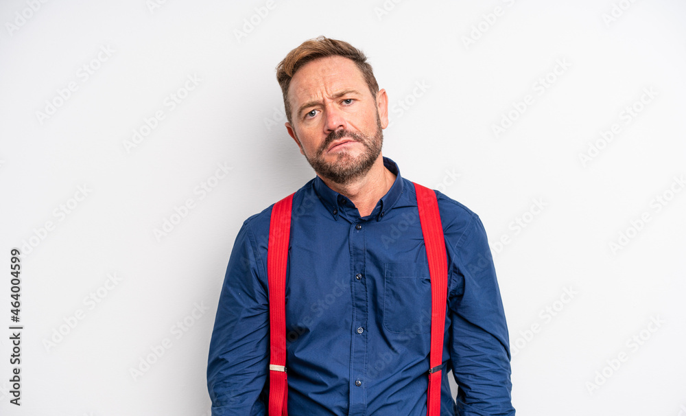 middle age handsome man feeling sad and whiney with an unhappy look and ...