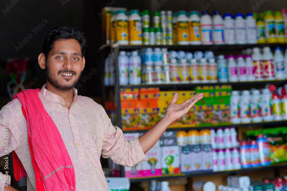 Indian farmer standing at fertilizer shop Stock Photo | Adobe Stock