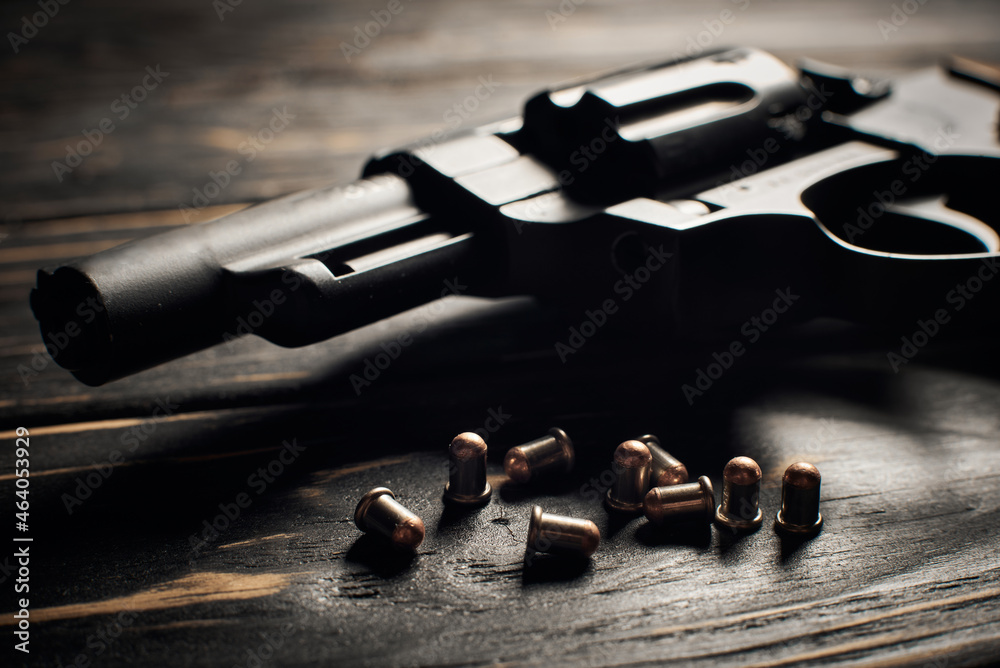 Revolver pistol with Flobert ammo 4mm on dark wooden background Stock ...