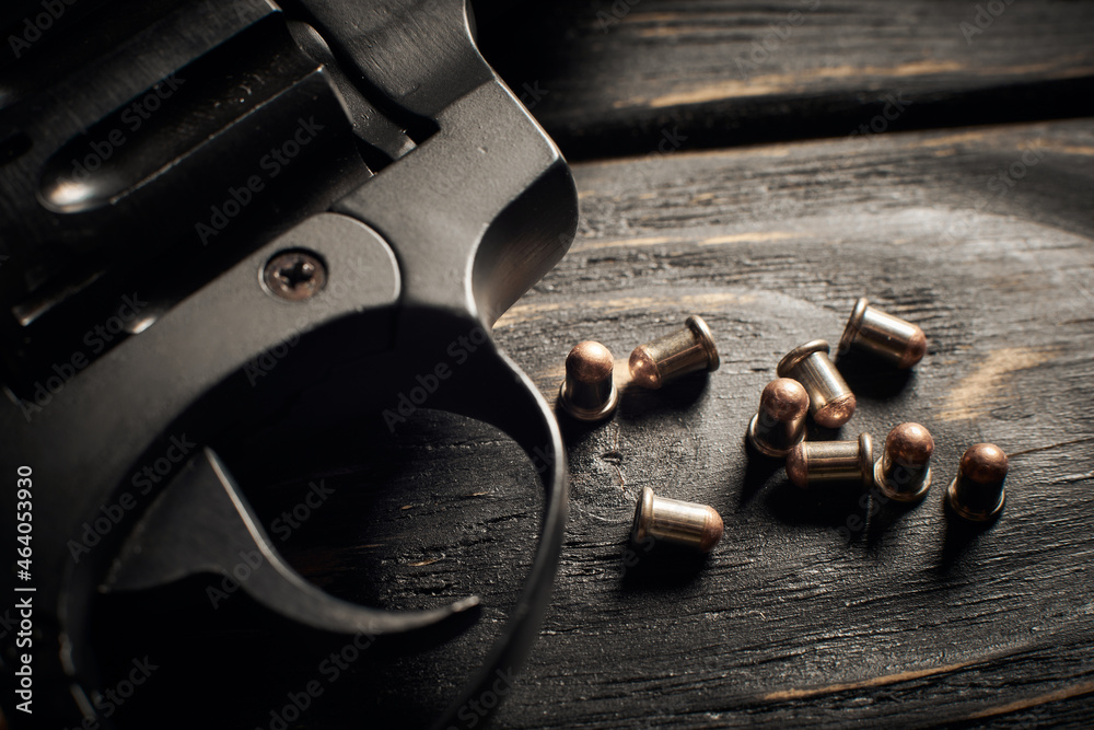 Revolver pistol with Flobert ammo 4mm on dark wooden background Stock ...