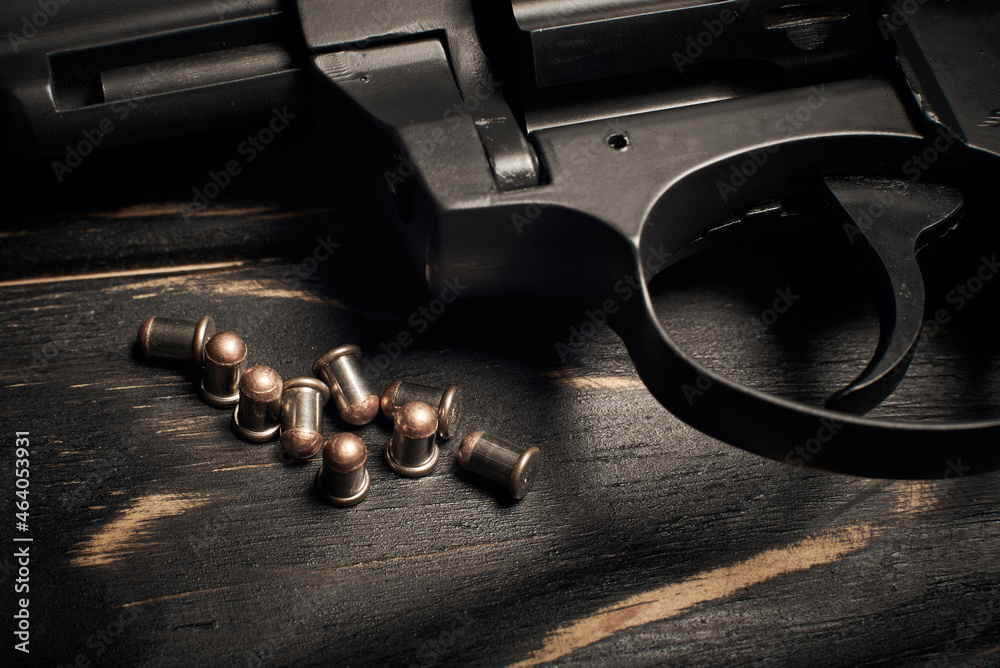 Revolver pistol with Flobert ammo 4mm on dark wooden background Stock ...
