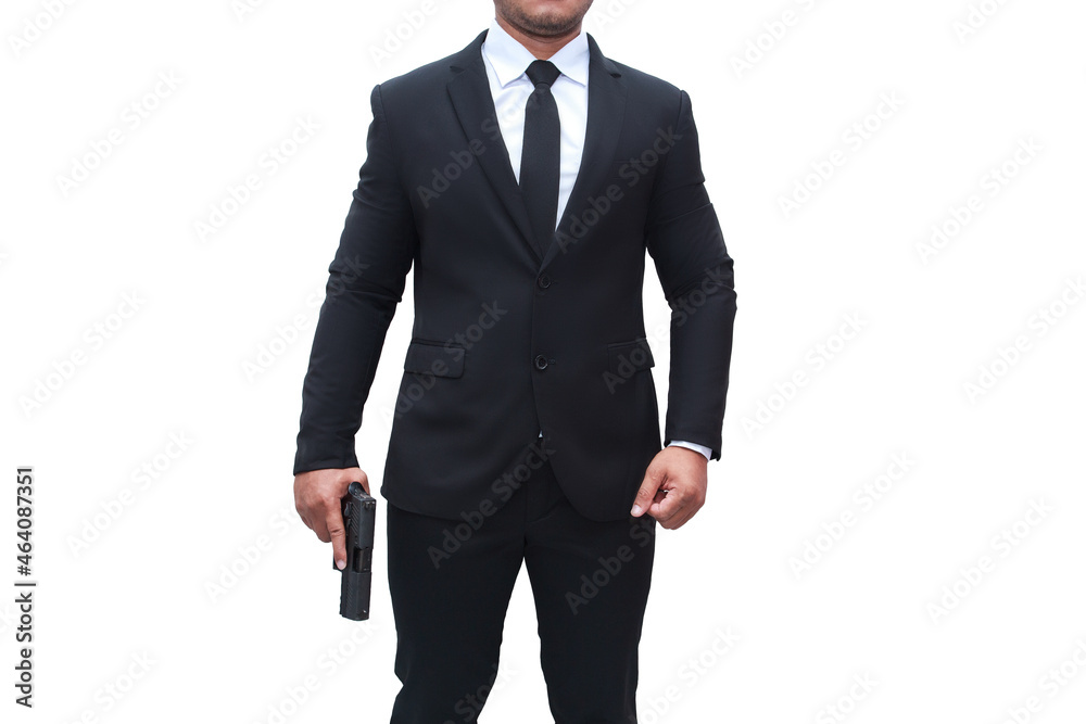 A gun man wearing a black suit is holding a gun in a stalwart pose on a ...
