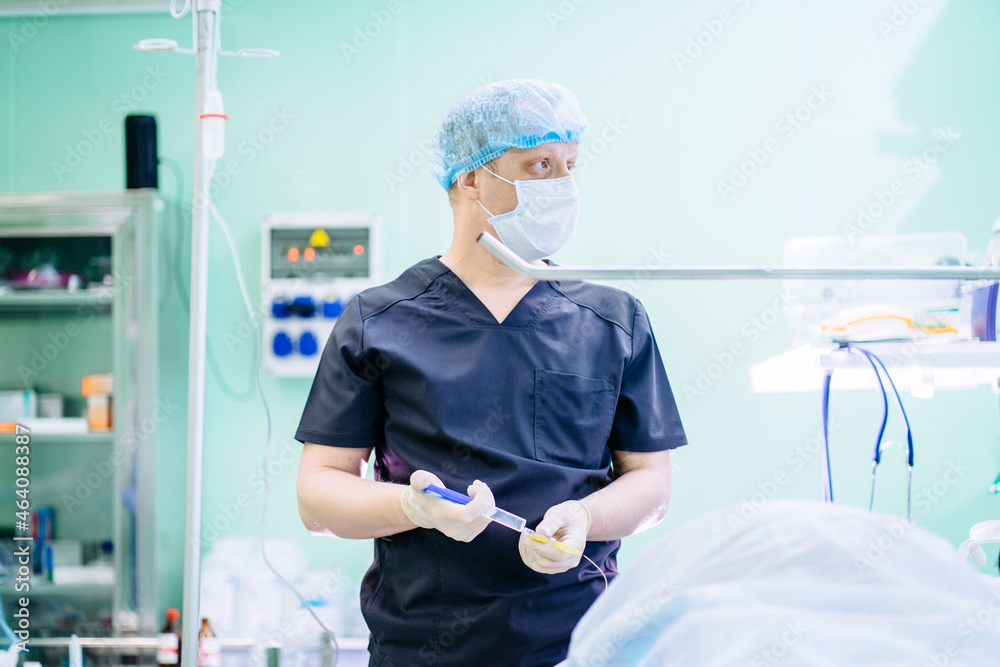 Male doctor injecting Epidural Anesthesia for pregnancy Labor during ...