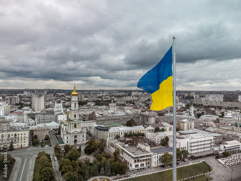 Flag of Ukraine close-up with autumnal colorless epic gray cloudscape ...