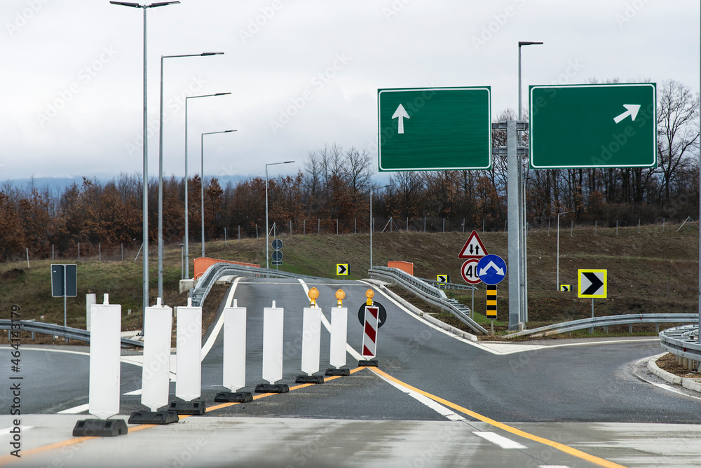 Driving on an empty road. Empty asphalt road through the green field ...