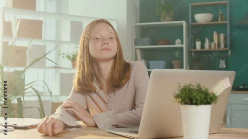 Tired Teenage Schoolgirl While Studying Online at a Laptop. Overwhelmed ...