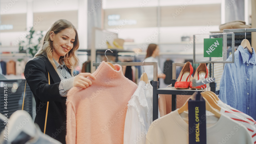 Beautiful Smiling Female Customer Shopping in Clothing Store, Choosing ...
