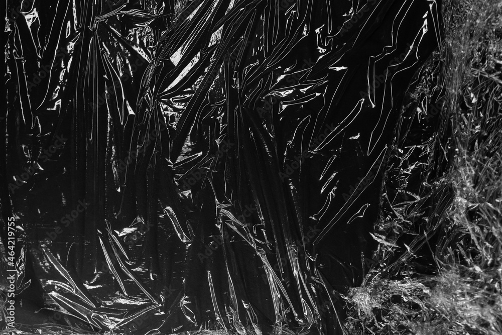 Reflecting light and shadow on creases and folds in scrunched plastic ...