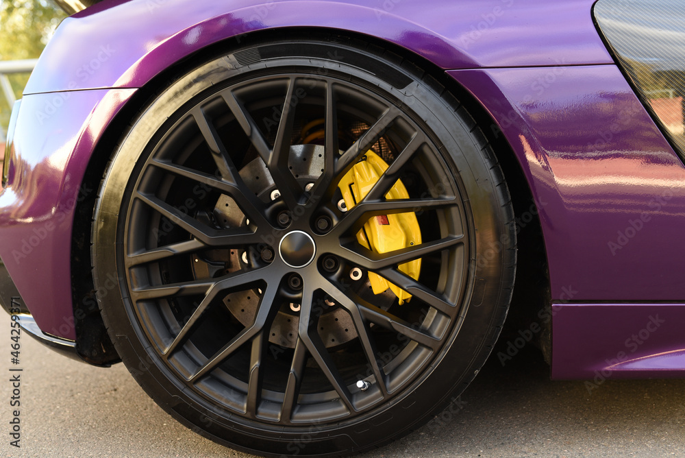 Alloy wheel with calipers and racing brakes of the sport car. Racing ...