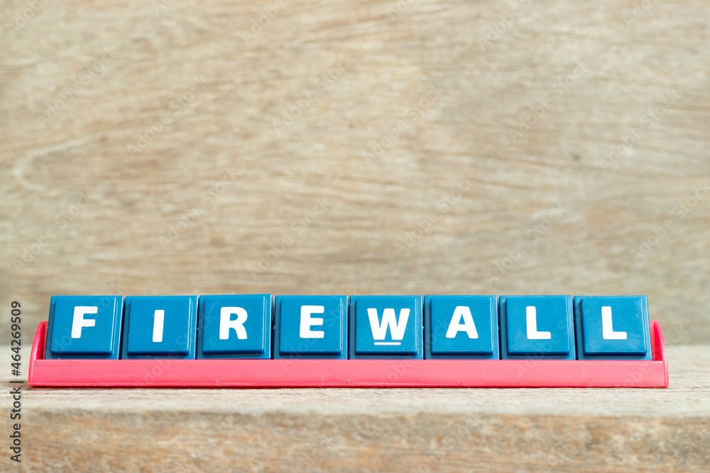Tile alphabet letter with word firewall in red color rack on wood ...