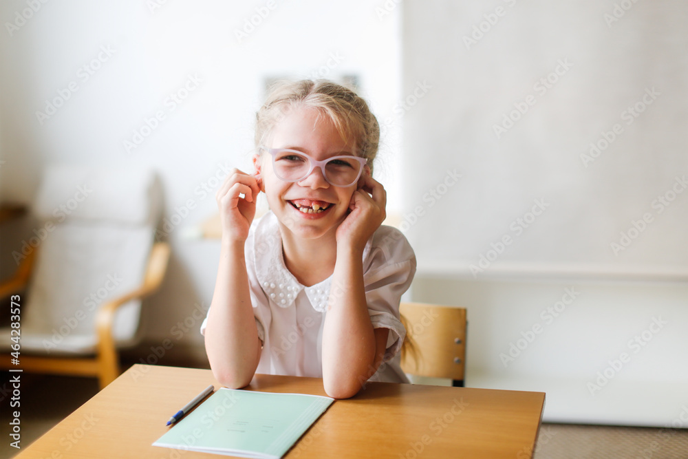 Children in class do exercises, kids pupils rub their ears and show ...