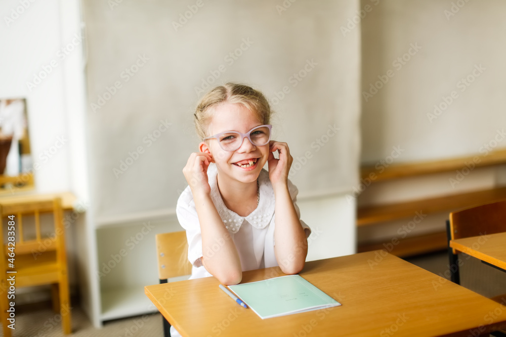 Children in class do exercises, kids pupils rub their ears and show ...